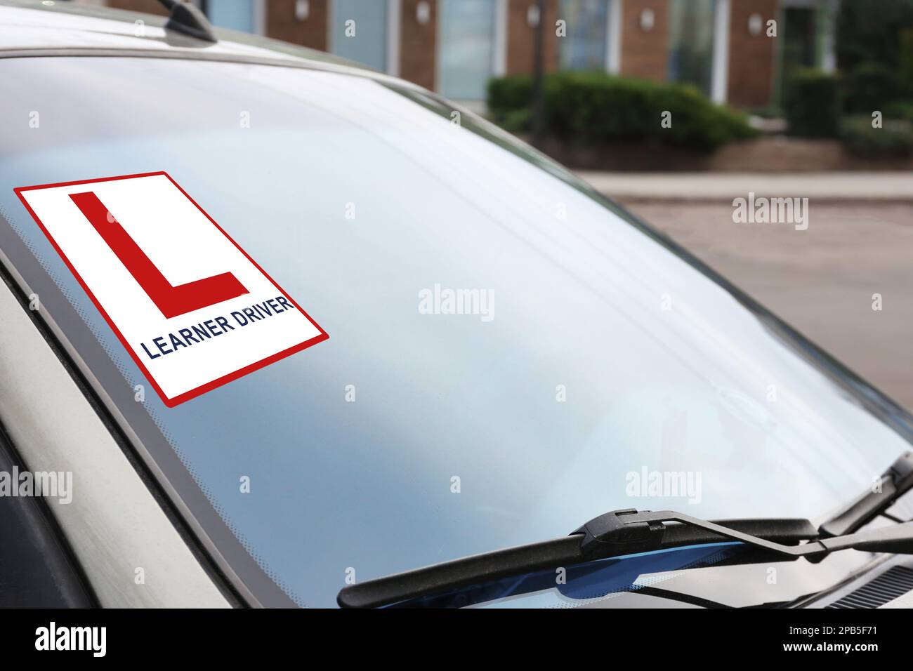 Modern car with L-plate sign on window, closeup Stock Photo - Alamy