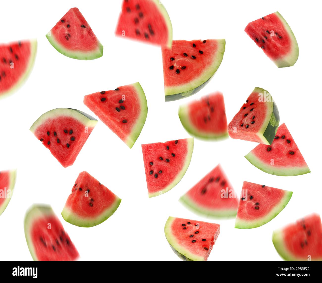 Slices of delicious ripe watermelon falling on white background Stock ...
