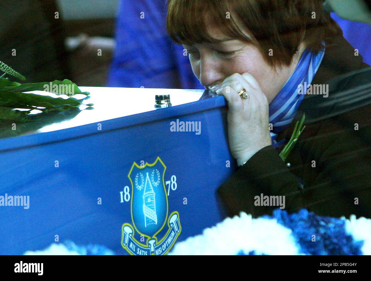 Melanie Jones the mother of Rhys Jones, kisses her son's coffin ...
