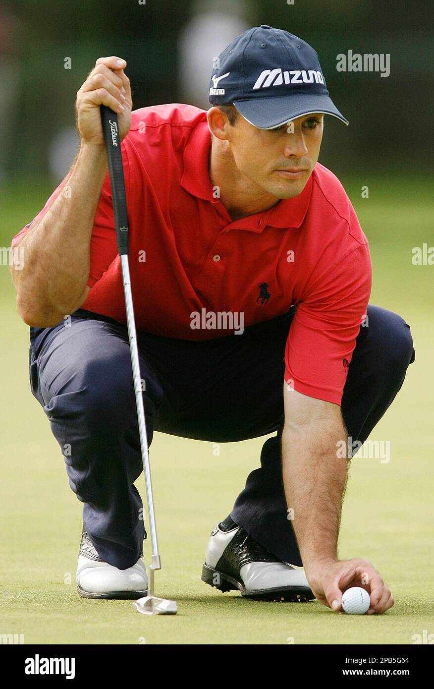 Jonathan Byrd lines up his putt on the 10th green during the first ...