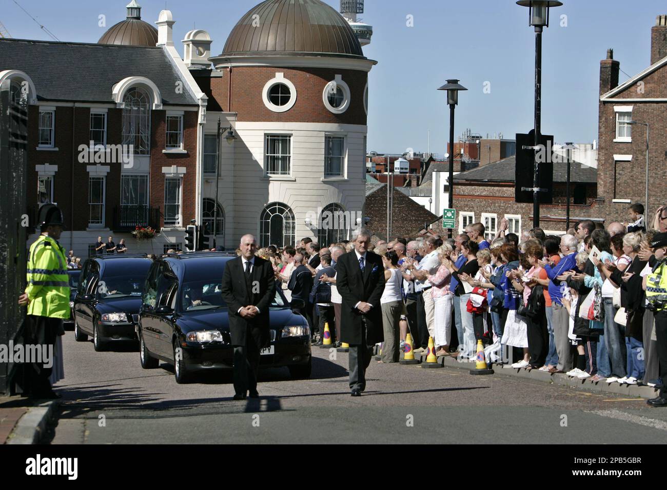 Residents appllaud as the funeral procession of murdered schoolboy Rhys ...