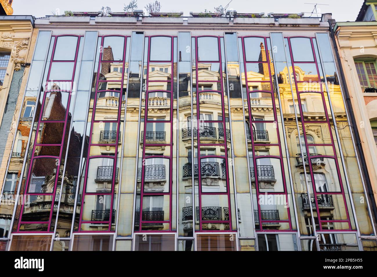 picture of an old building reflecting in a mirror facade in Lille ...