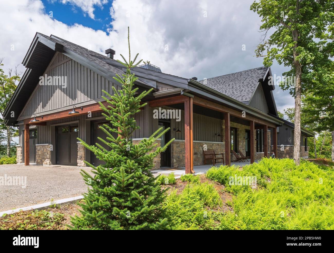 Cut stone and charcoal wood plank with black trim hybrid timber frame ...