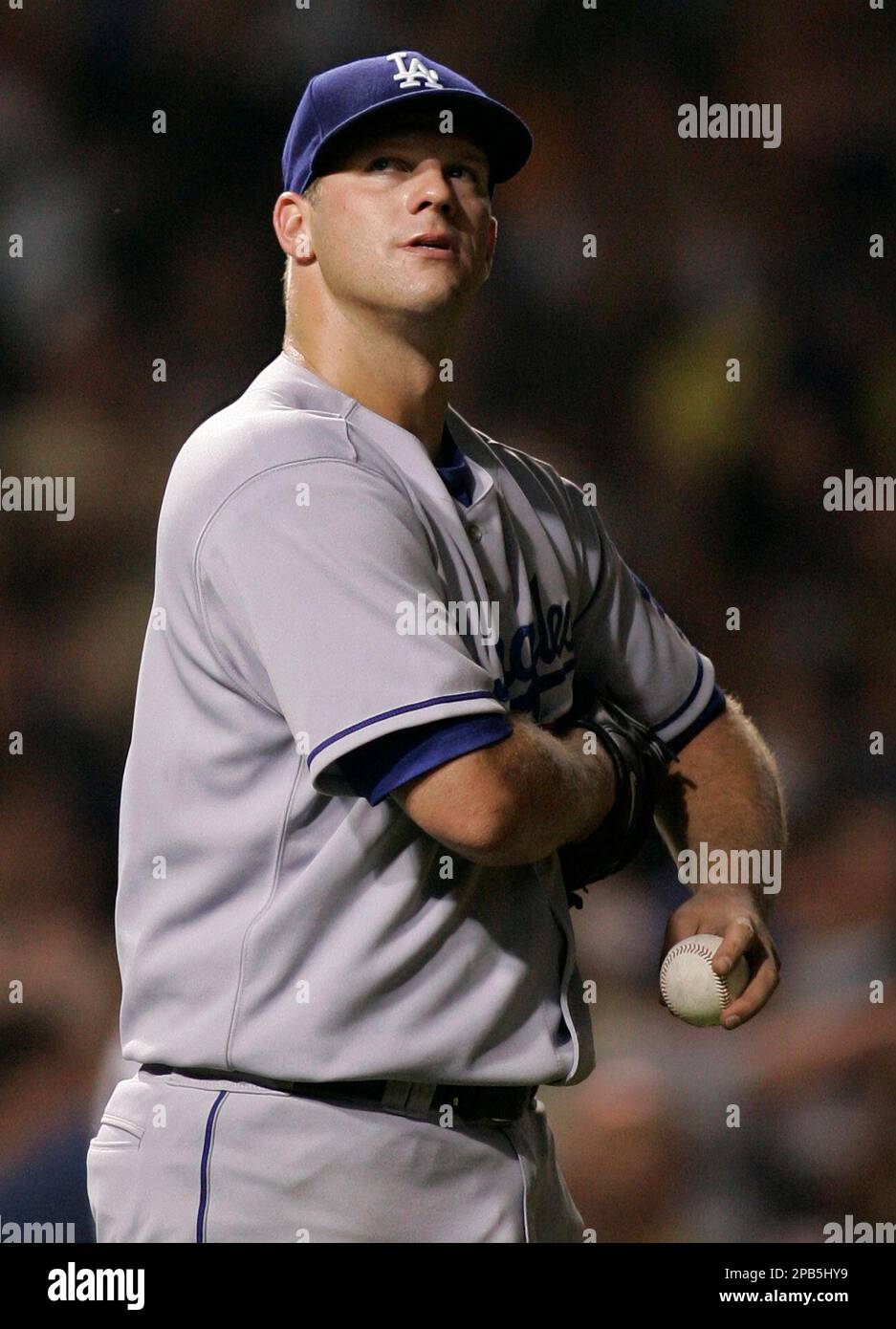 Los Angeles Dodgers starting pitcher Eric Stults reacts after giving up ...