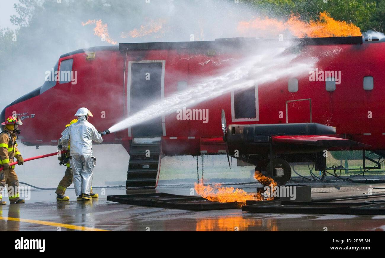 Fire fighters from the Traverse City Fire Department douse flames ...