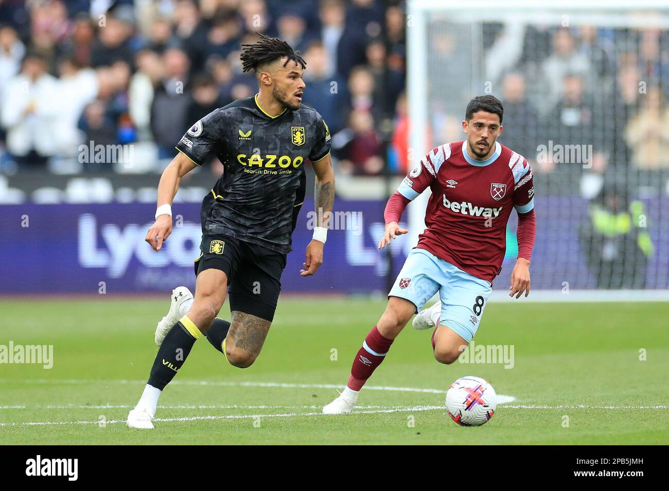 London, UK. 12th Mar, 2023. Tyrone Mings of Aston Villa dribbling with ...