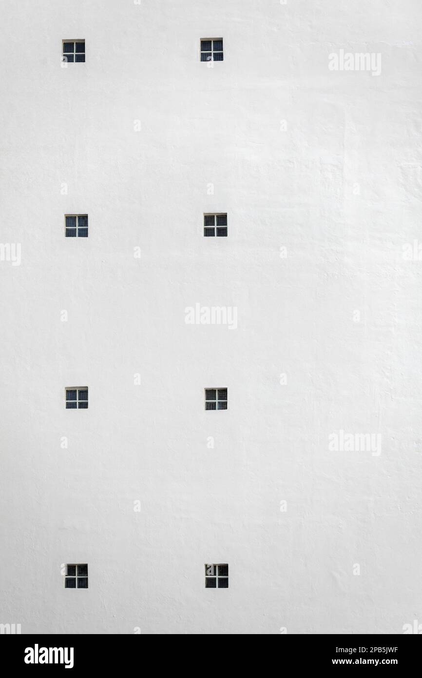 decorative white wall with two rows of tiny windows Stock Photo - Alamy