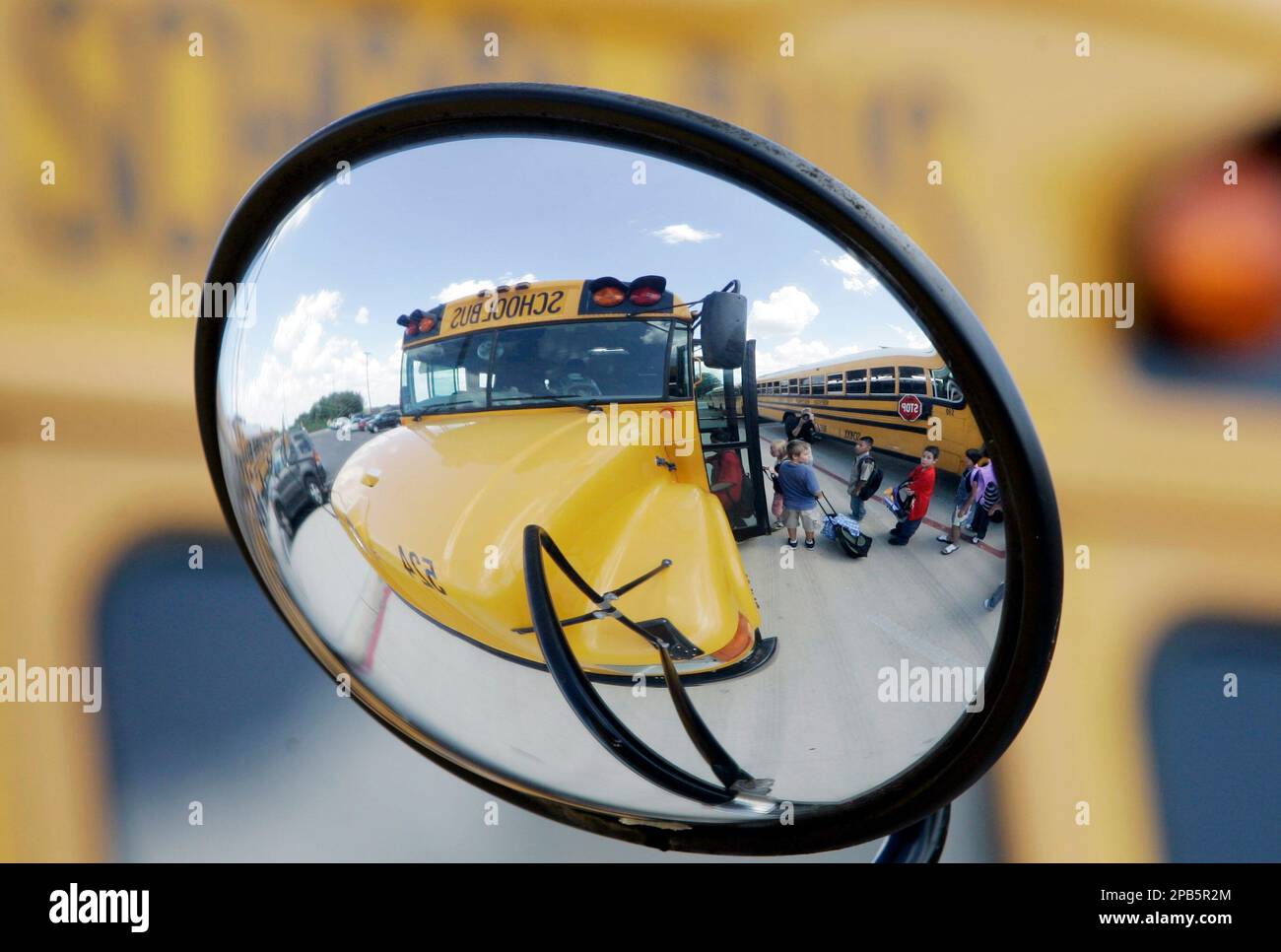 ** FOR USE WITH AP LIFESTYLES ** Students are reflected in a mirror as ...