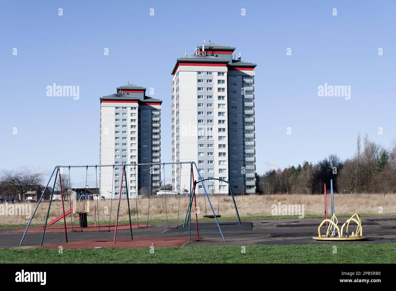 High rise council flats in poor housing estate and empty play area ...