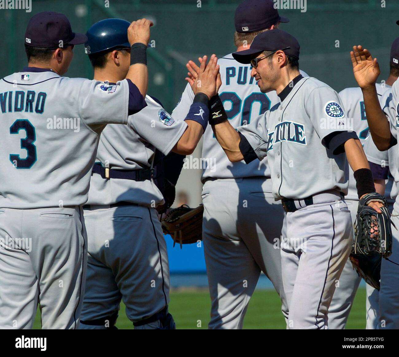 Seattle Mariners' Ichiro Suzuki, right celebrates with catcher Kenji ...