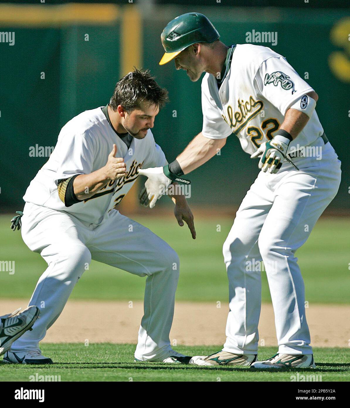 Oakland Athletics' Jack Hannahan, right, celebrates with teammate Nick ...