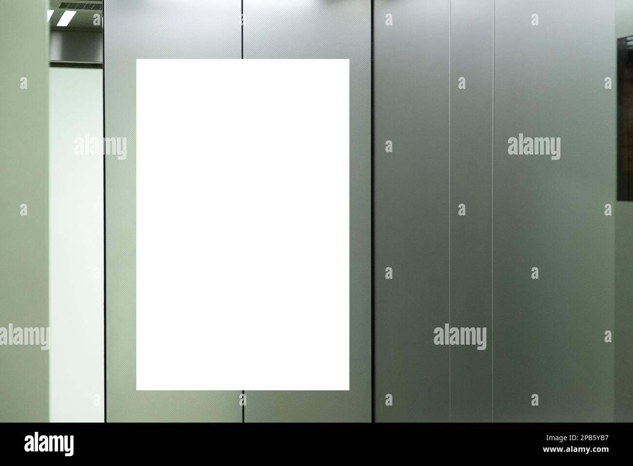 Mock up. Vertical poster media template frame hanging on the wall ...