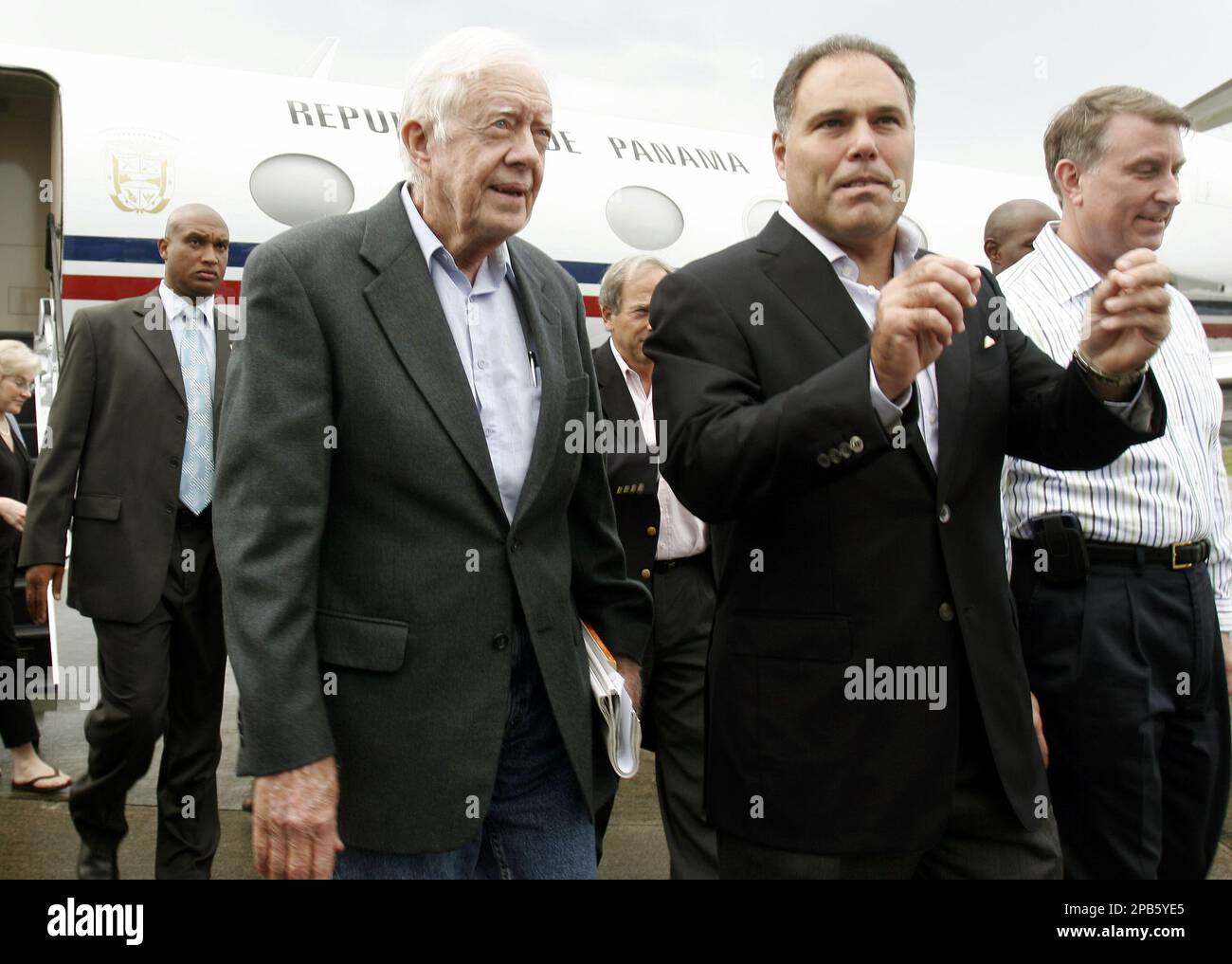 Former U.S. President Jimmy Carter, center left, walks with Panama's ...