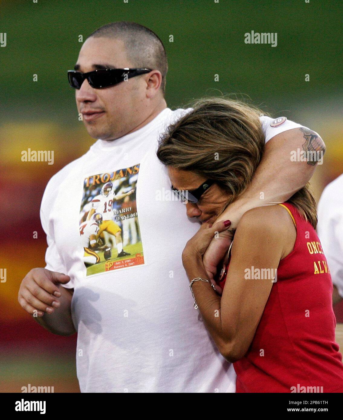 Tony Danelo, left, comforts his mother, Emily, mother of the late ...