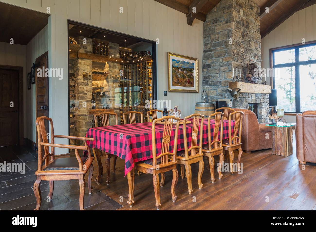 Teak table with high back chairs and stained red pine wood floorboards ...