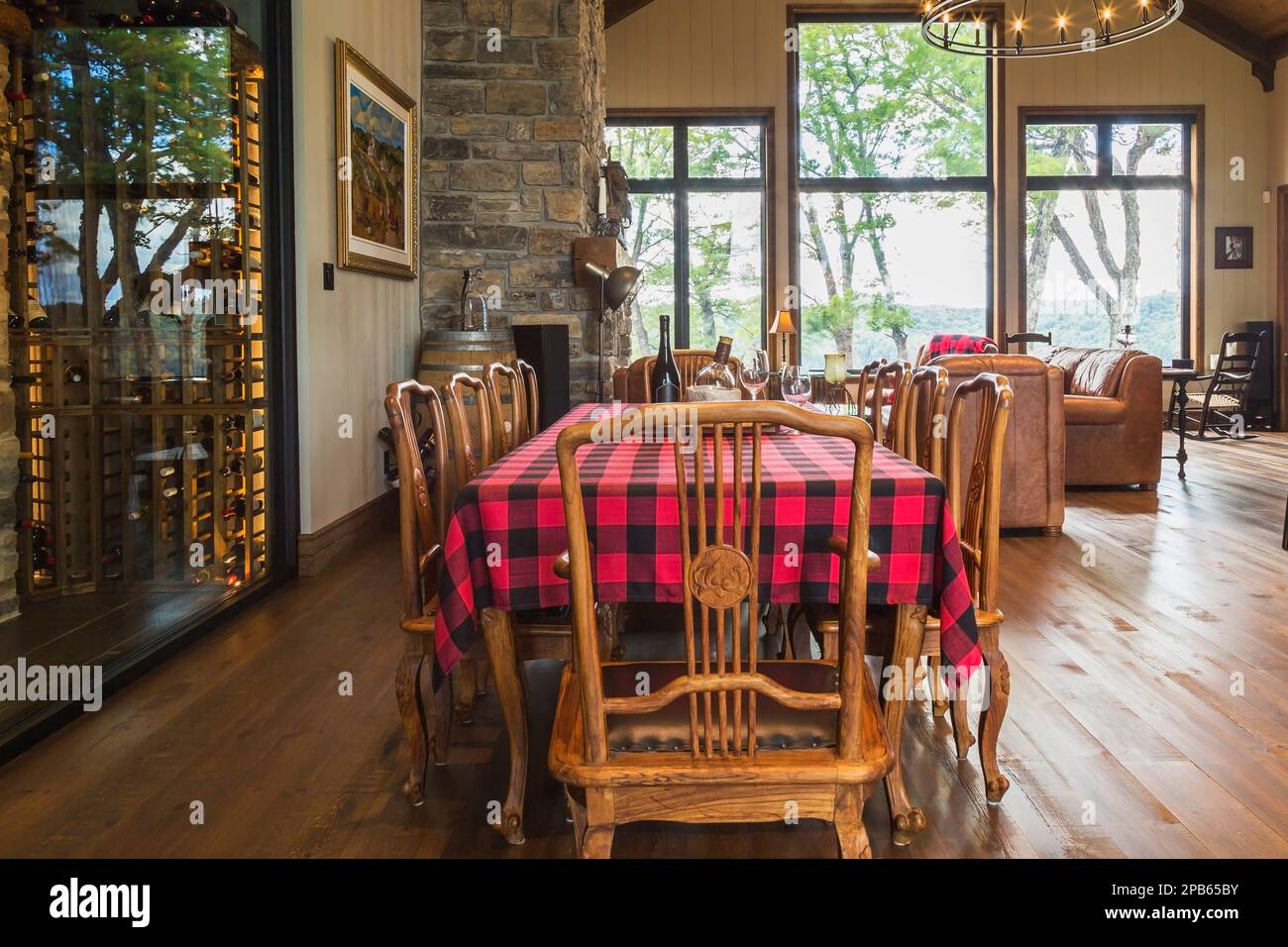 Teak table with high back chairs and stained red pine wood floorboards ...
