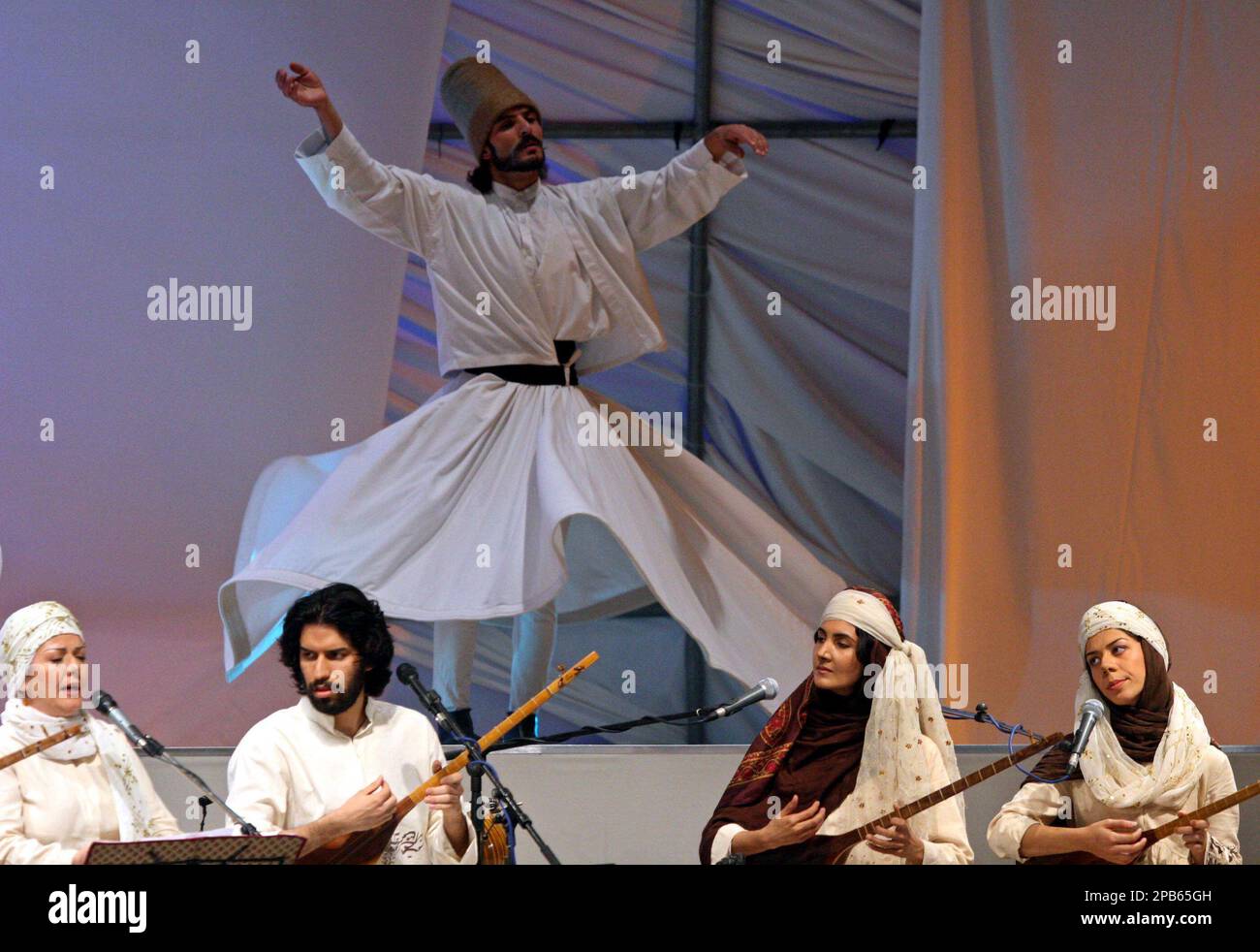 Iranian musicians, seated from left: Najmeh Tajaddod, Sohrab Pournazeri, Neda Khaki, and Sahar ...