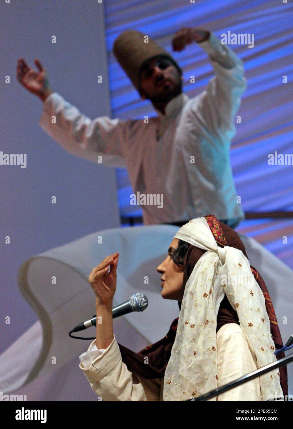 Iranian female singer Neda Khaki, bottom, performs, with Turkish Sema ...