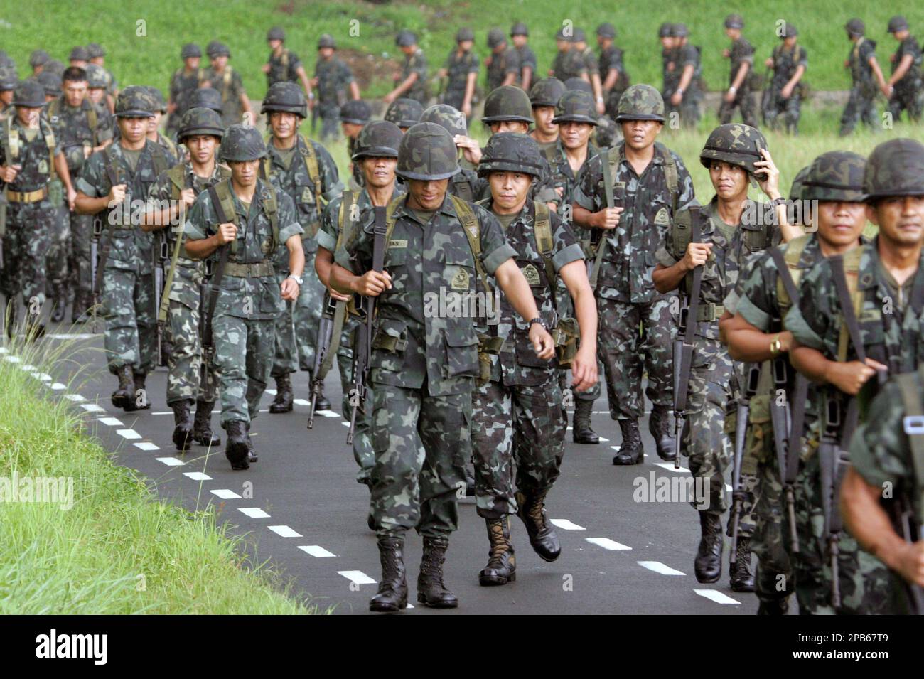 A contingent of Philippine Marines based in the capital march following ...