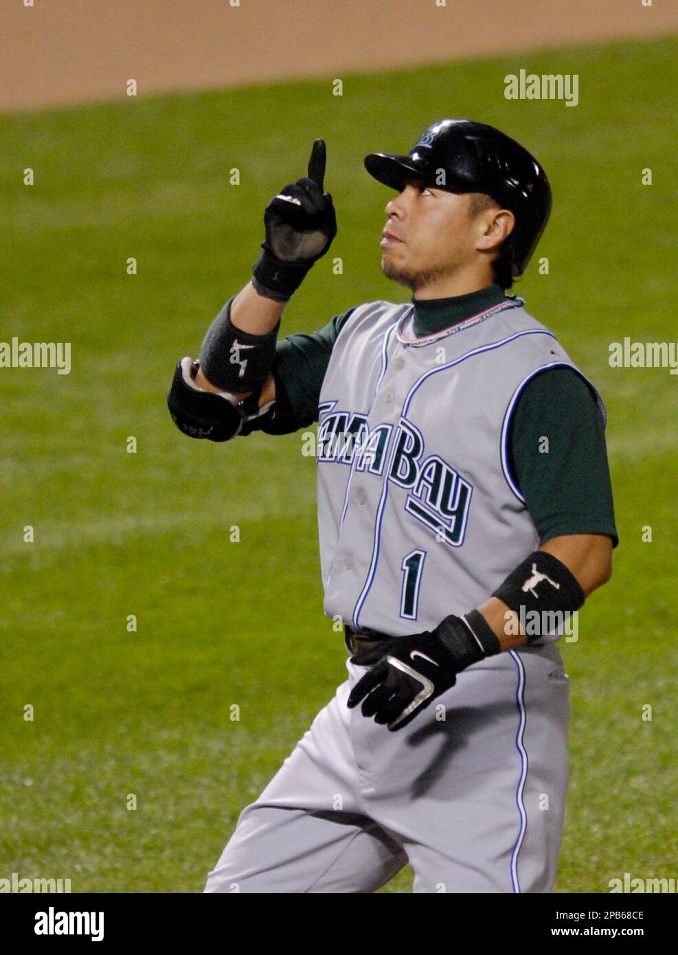 Tampa Bay Devil Rays' Akinori Iwamura of Japan points up while ...