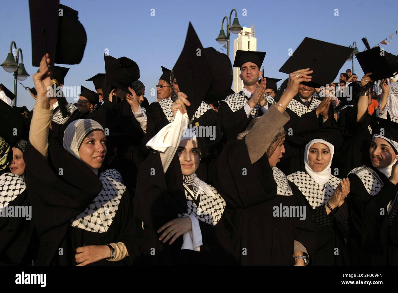 Palestinian students attend their graduation ceremony at An-Najah ...