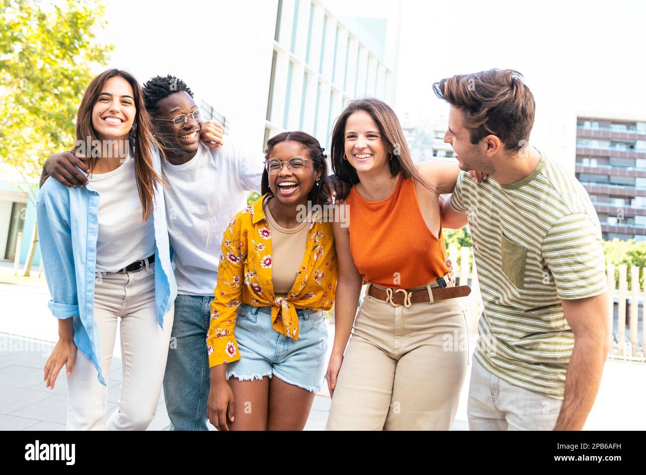 Group of smiling multiracial friends having fun outdoors - Cheerful ...