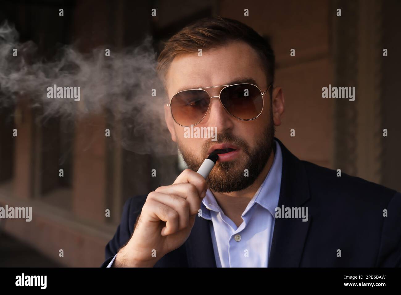 Young man smoking disposable hi-res stock photography and images - Alamy