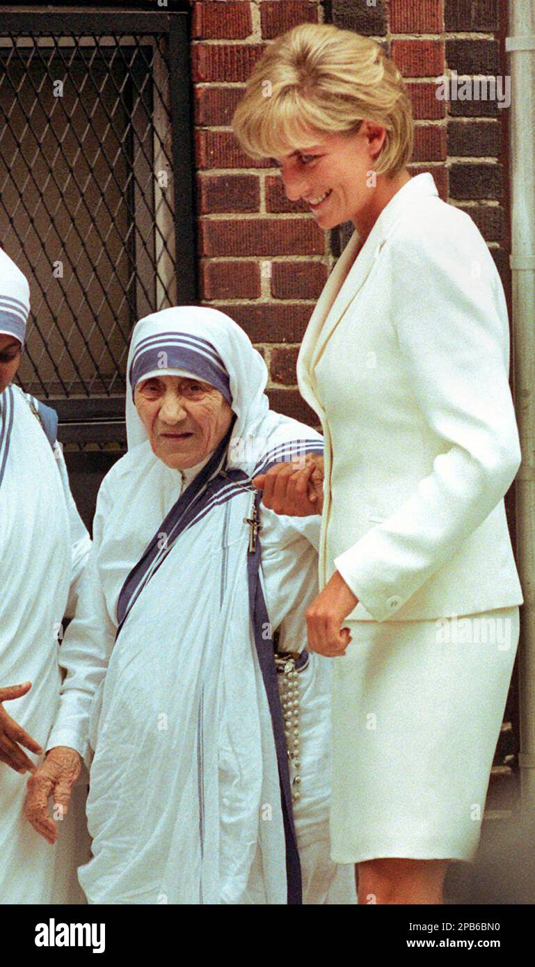 ** FILE ** Mother Teresa, left, walks with Diana, Princess of Wales ...