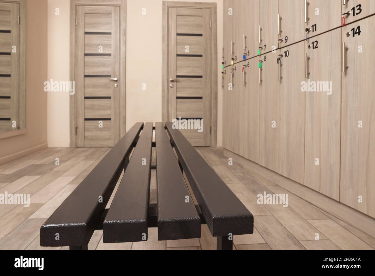 Wooden bench near lockers in changing room Stock Photo - Alamy