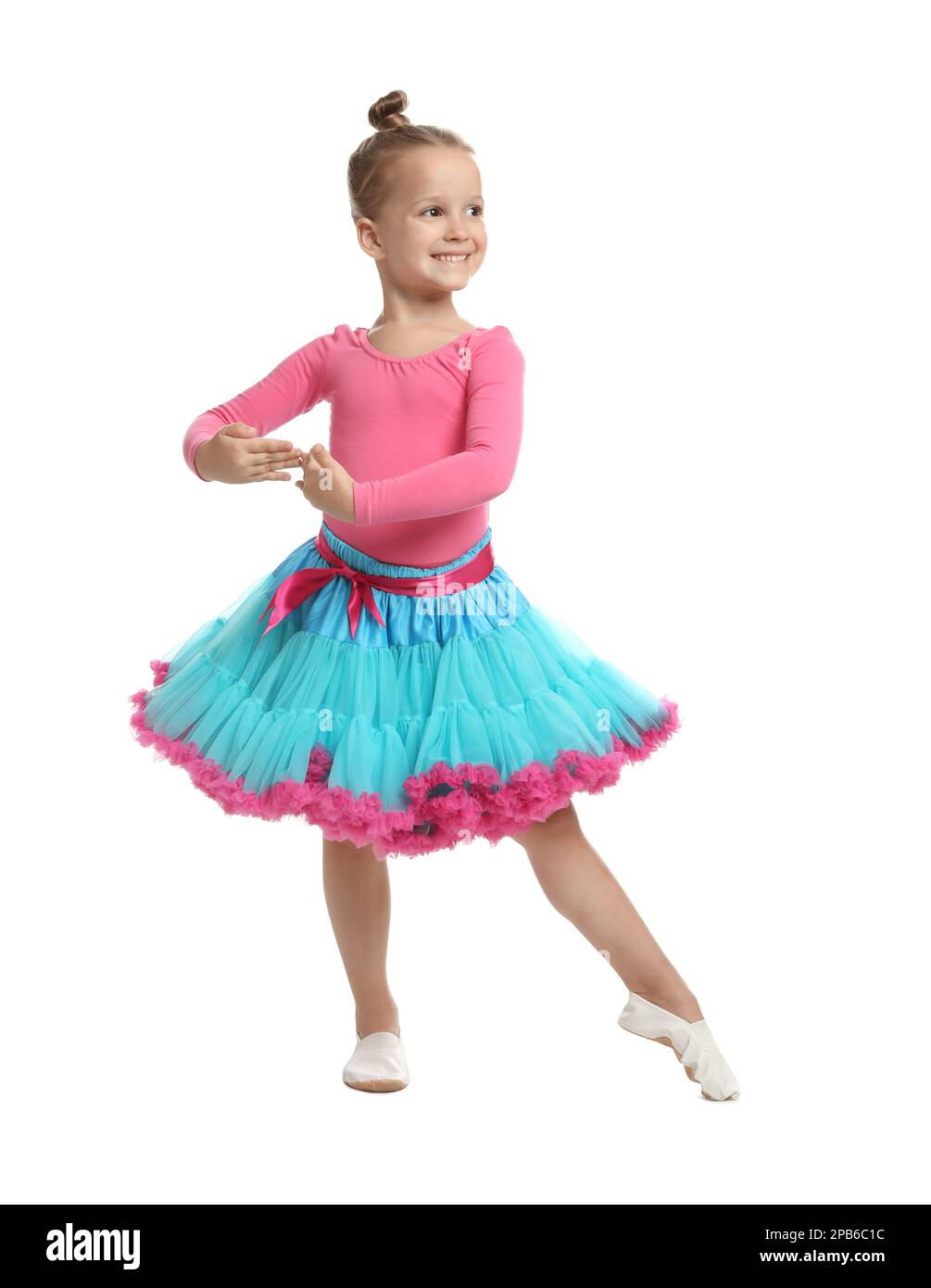 Cute little girl in costume dancing on white background Stock Photo - Alamy