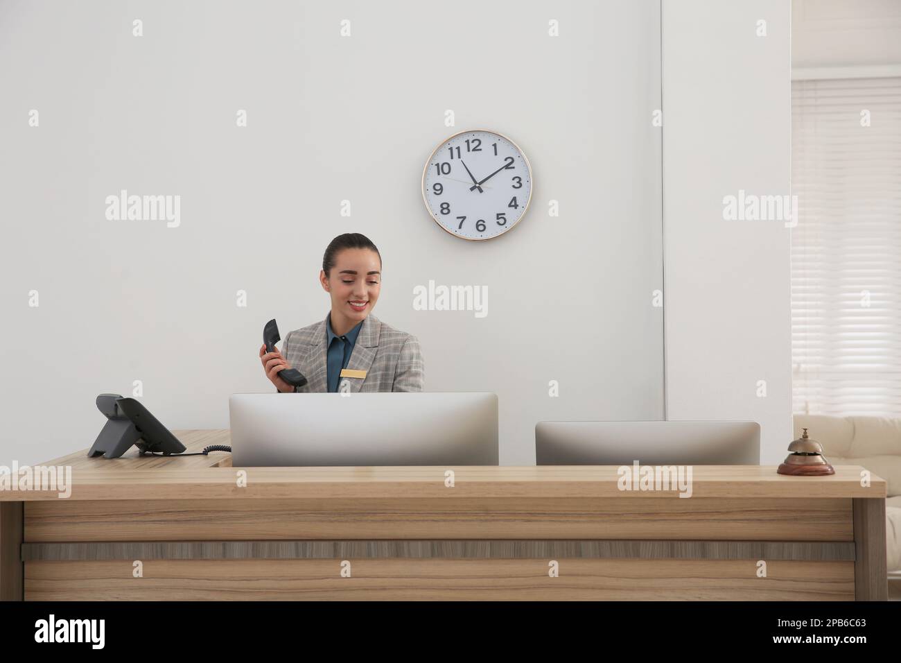 Hotel receptionist working computer hi-res stock photography and images ...