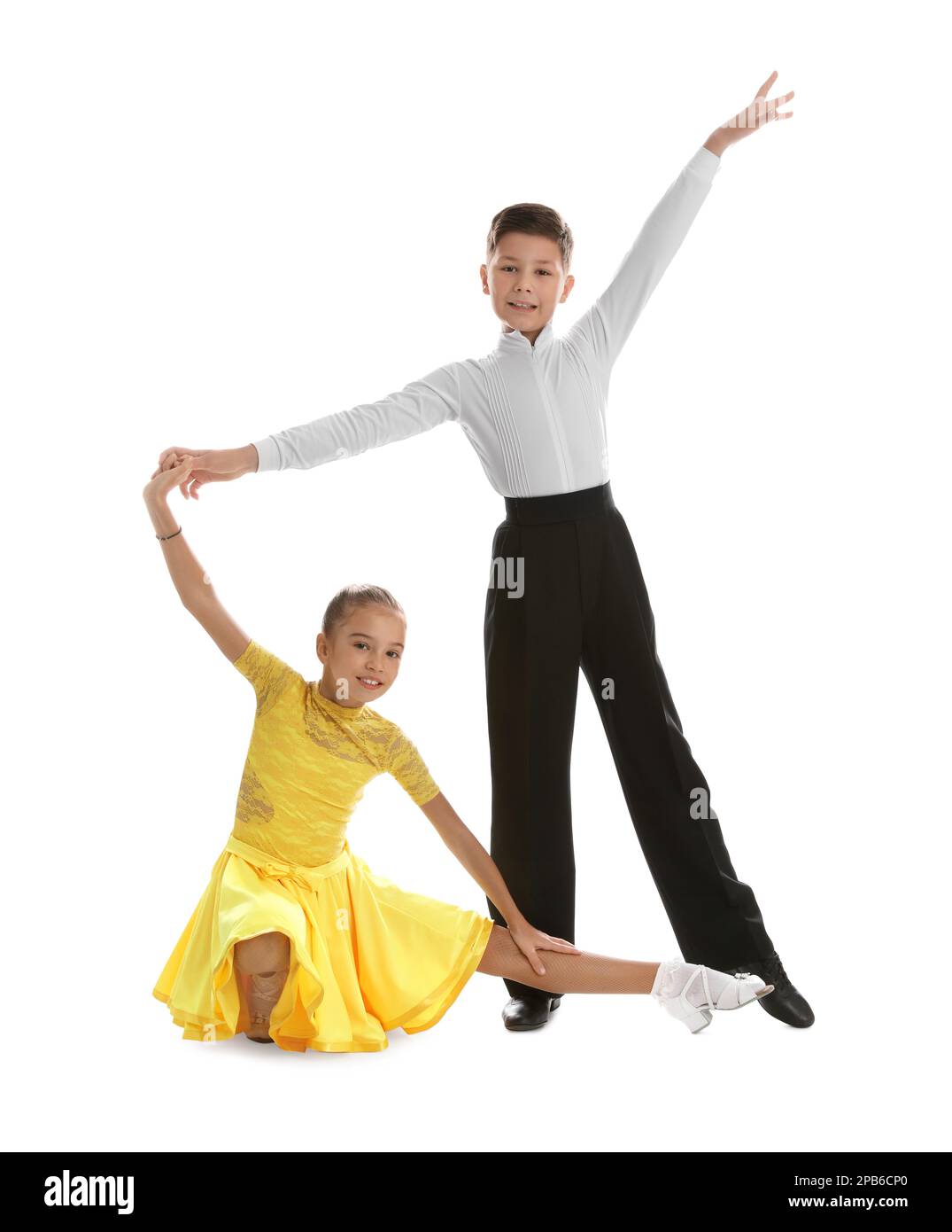 Beautifully dressed couple of kids dancing on white background Stock ...