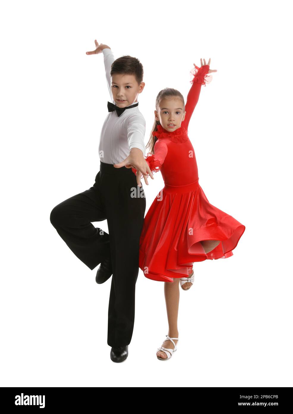 Beautifully dressed couple of kids dancing on white background Stock ...
