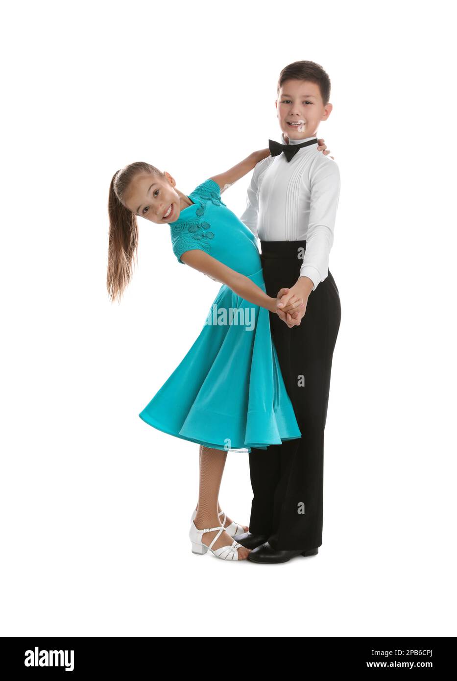 Beautifully dressed couple of kids dancing on white background Stock ...