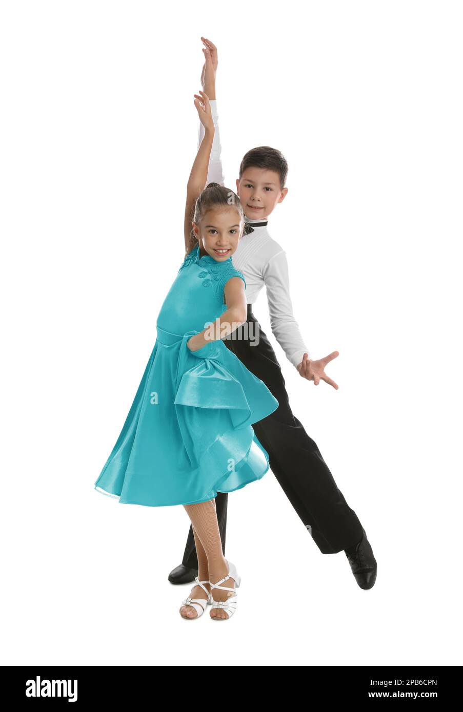 Beautifully dressed couple of kids dancing on white background Stock ...