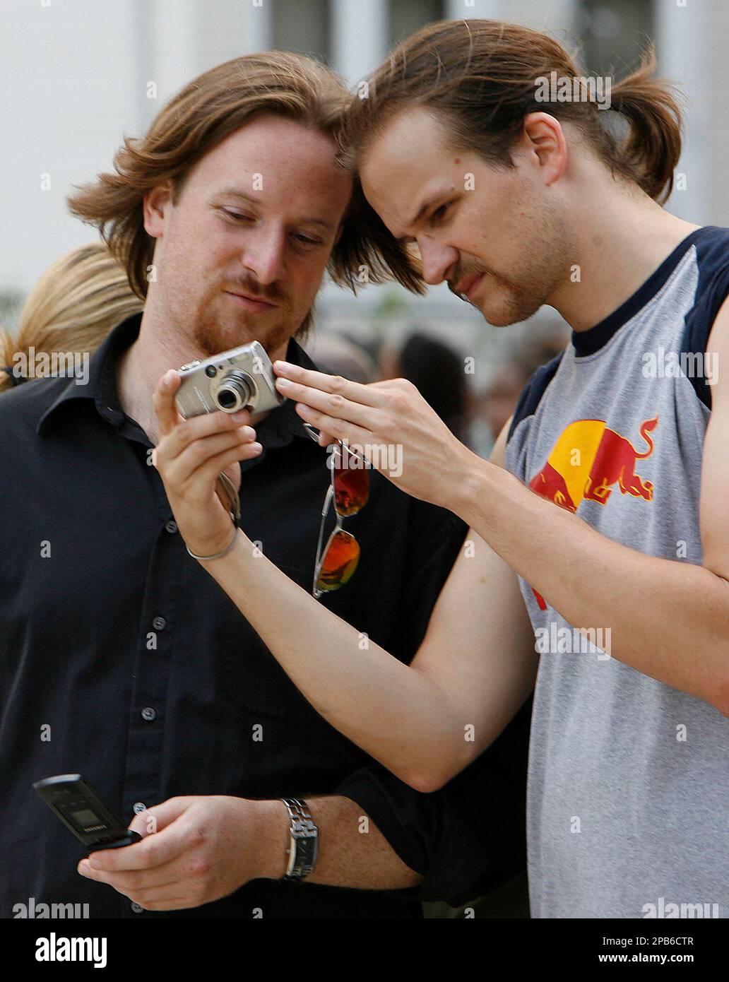Skylar Moran, left, and Sam Perkins-Harbin check their camera as they ...