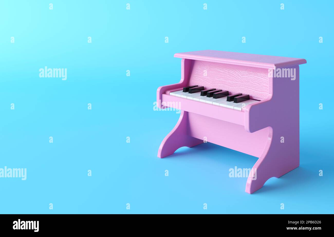 Baby pink piano music toy isolated on blue background. Minimal style ...