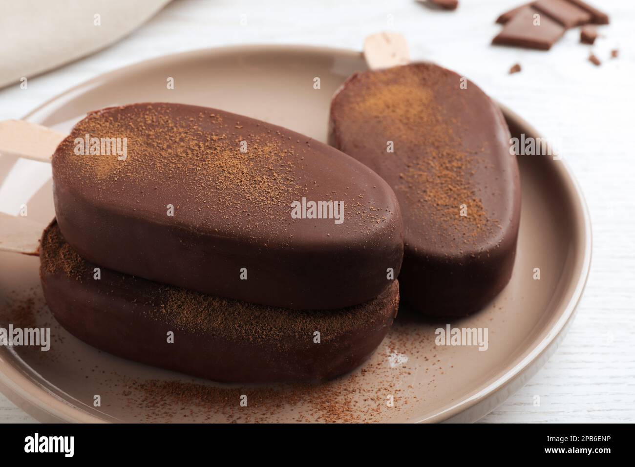 Delicious glazed ice cream bars on white wooden table, closeup Stock ...