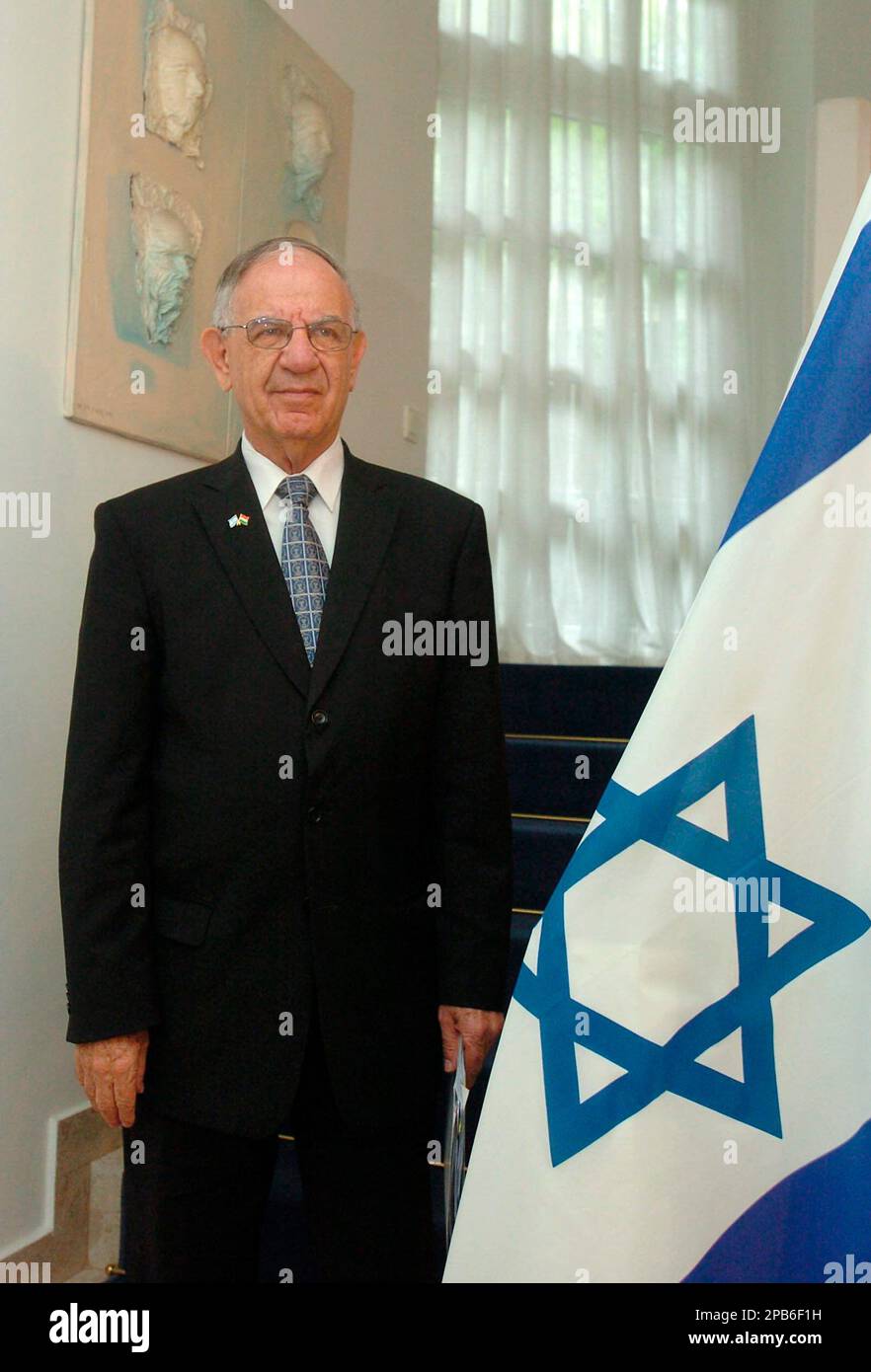 Outgoing Israeli ambassador to Hungary David Admon stands next to an ...