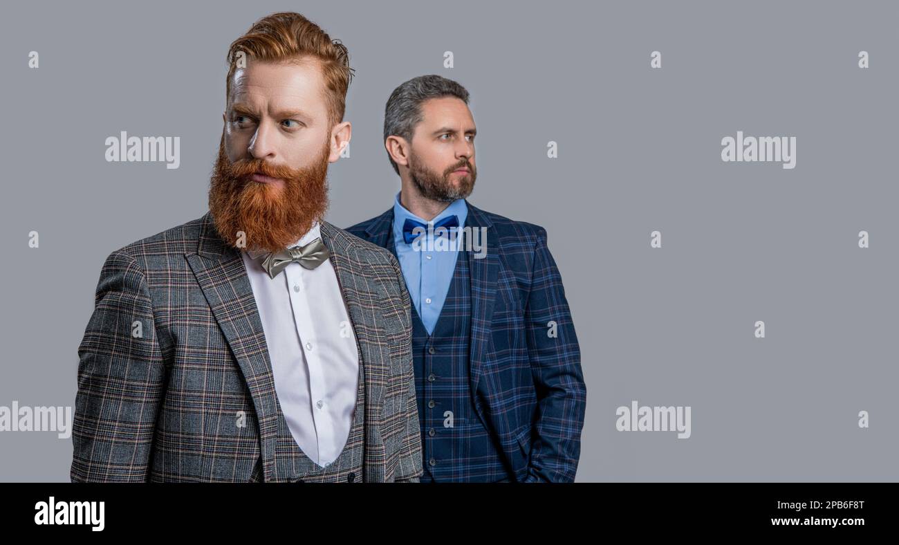 men in tux at studio, copy space. men in tux on background. photo of ...