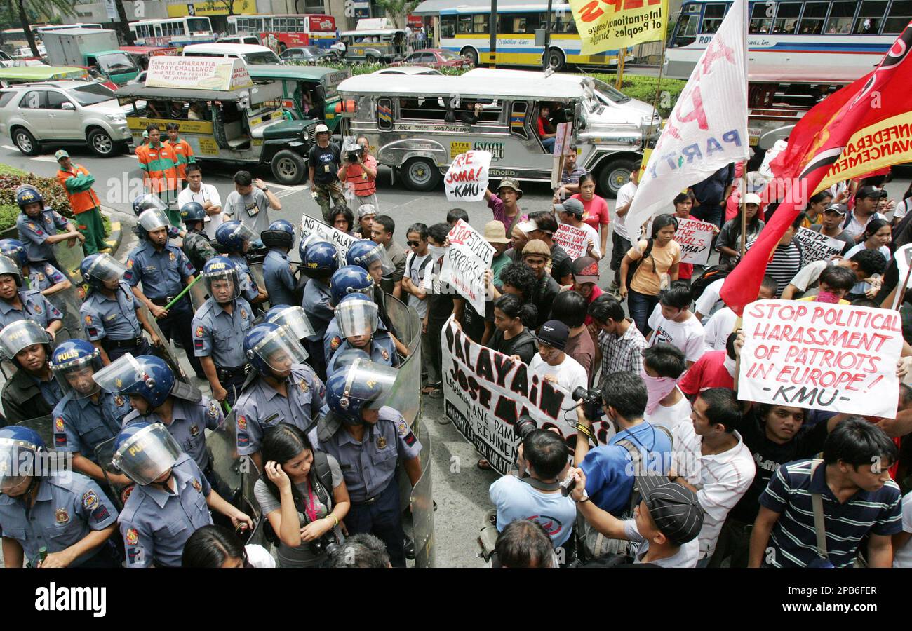 Riot police block militant youths from marching towards the Dutch ...