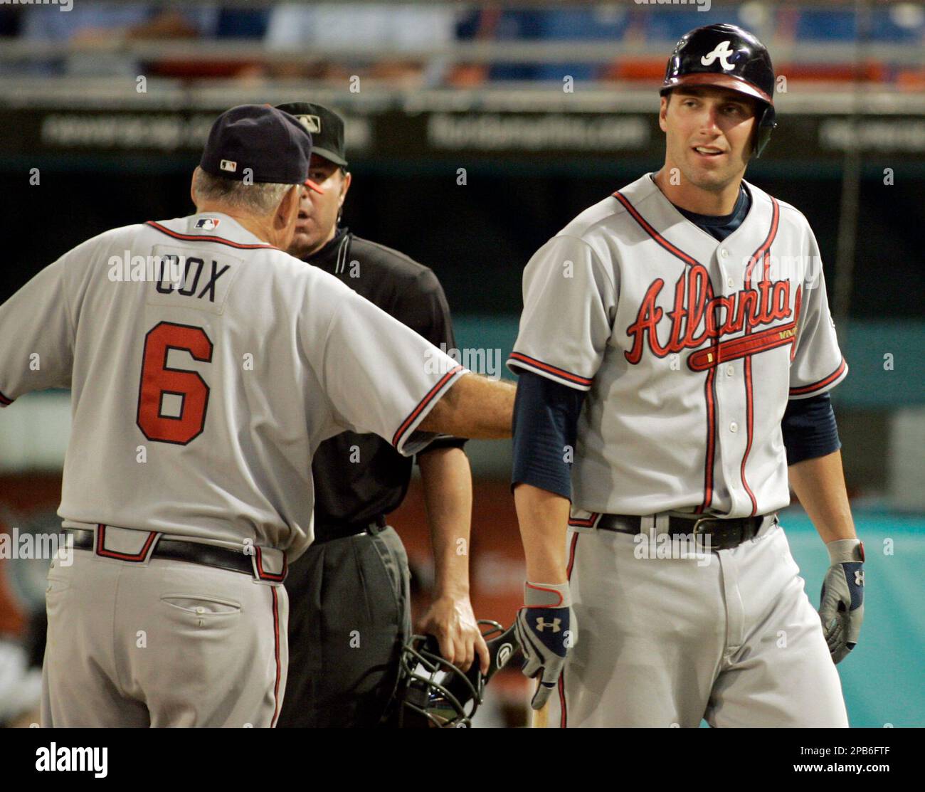Atlanta Braves' Jeff Francoeur, right, heads to the dugout after ...
