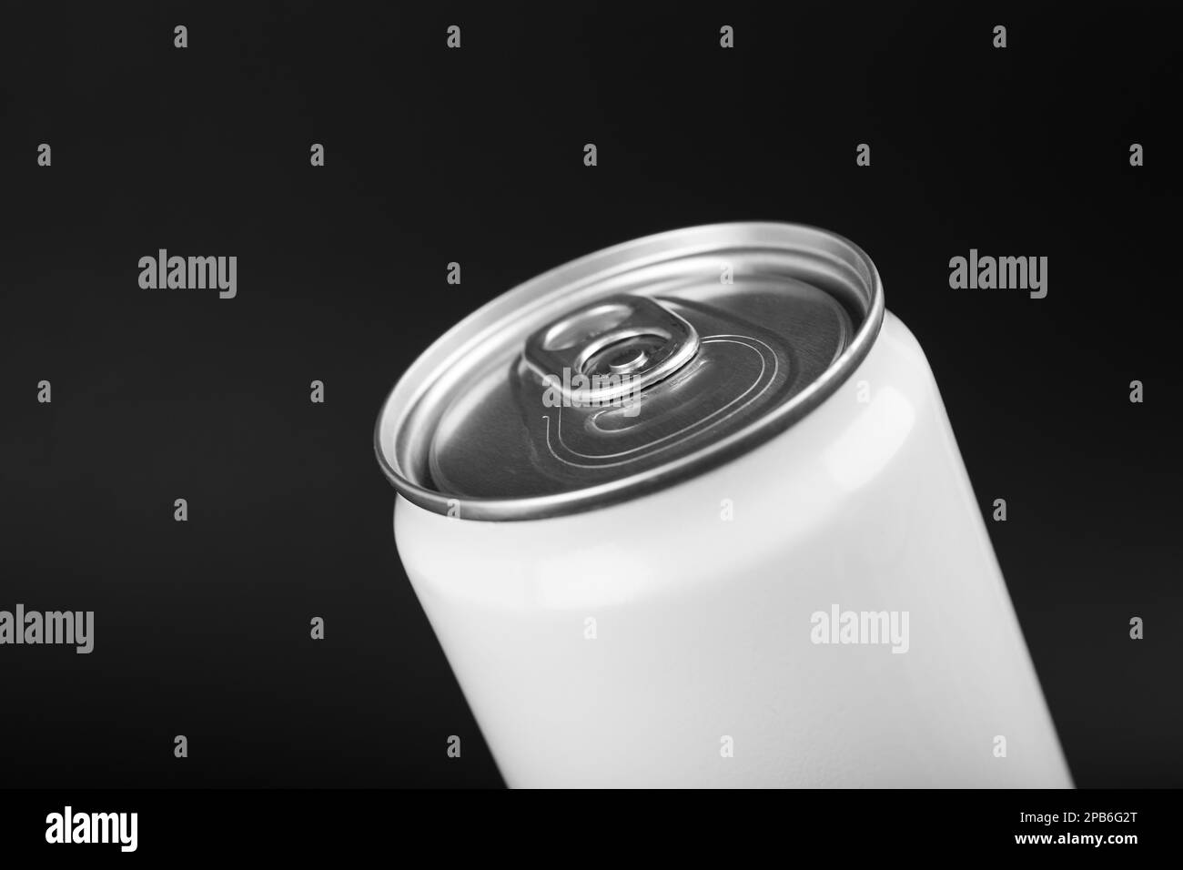 White can of energy drink on black background, closeup. Space for text ...