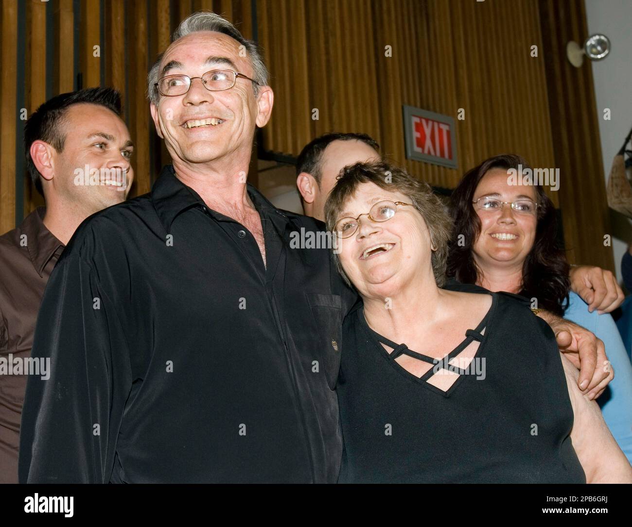 Steven Truscott smiles as he stands with his wife Marlene (right), son ...