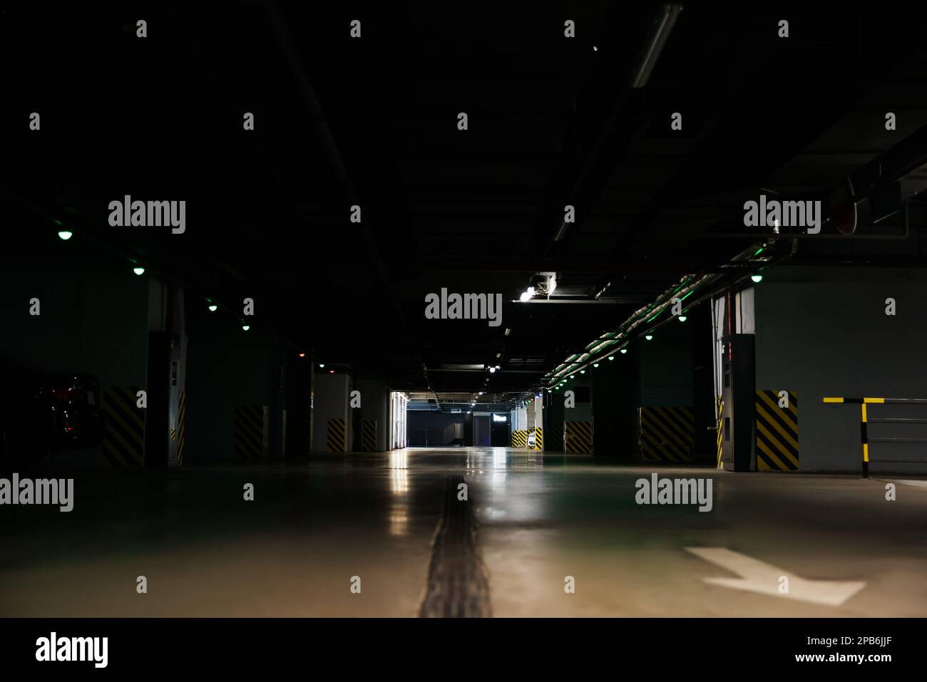 Dark modern car parking garage at night Stock Photo - Alamy