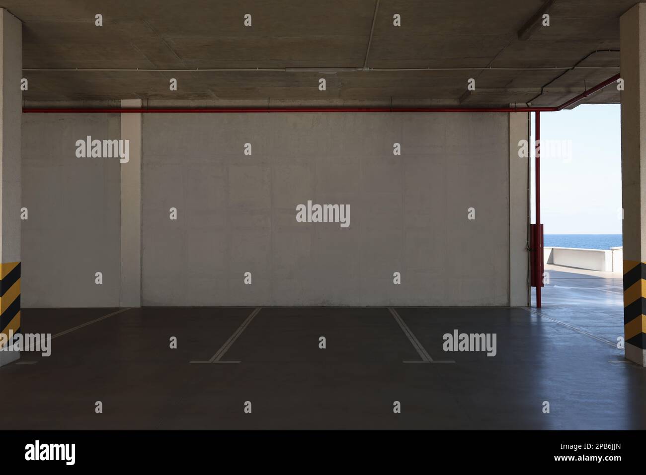 Empty open car parking garage on sunny day Stock Photo - Alamy