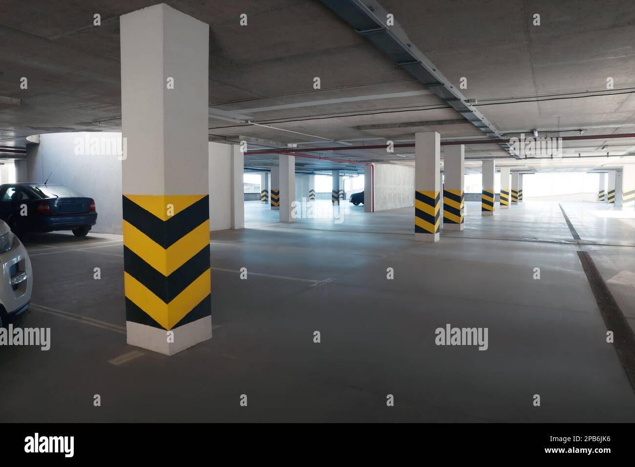 Open parking garage with cars on sunny day Stock Photo - Alamy