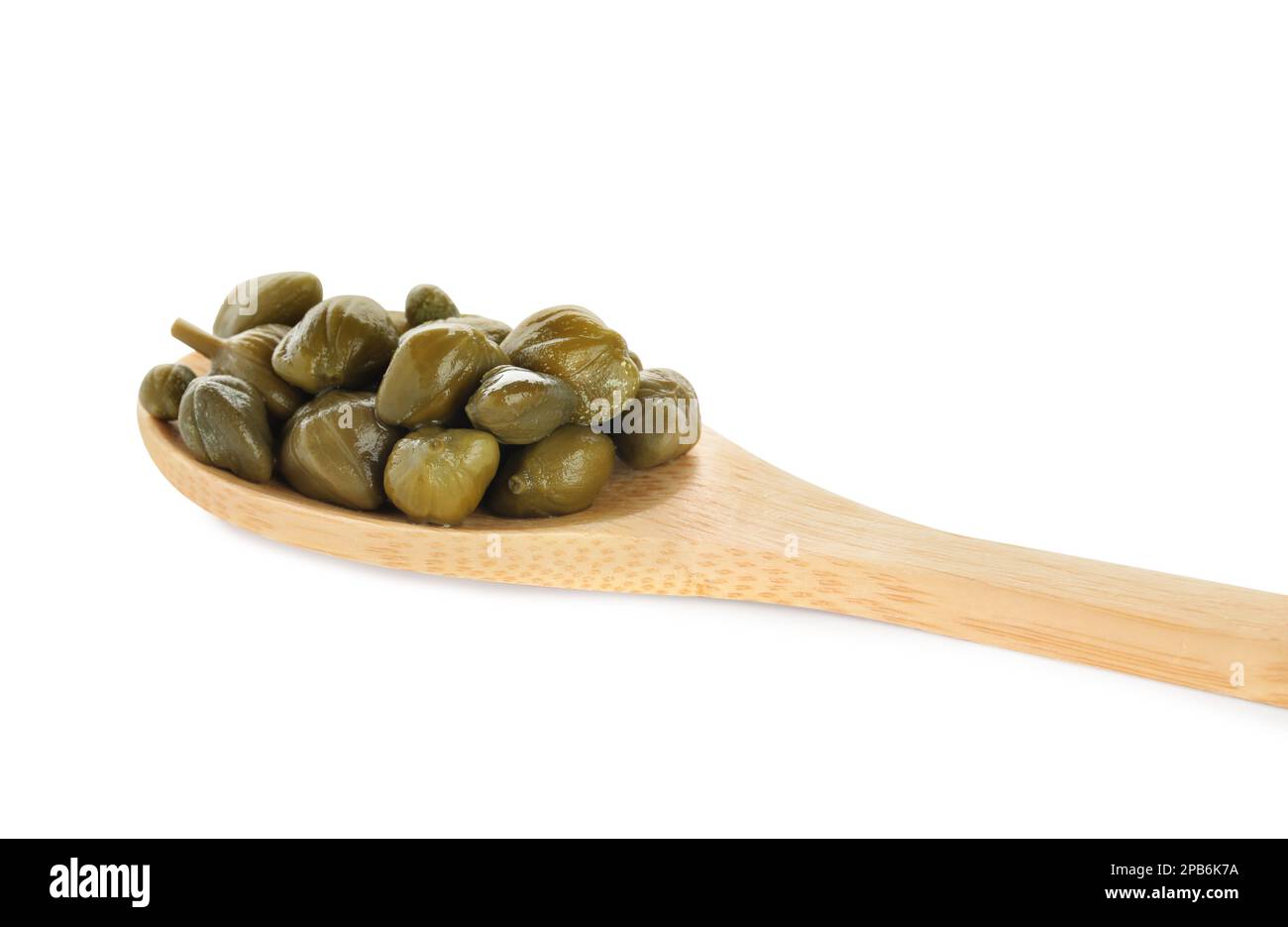 Wooden spoon with capers on white background Stock Photo - Alamy