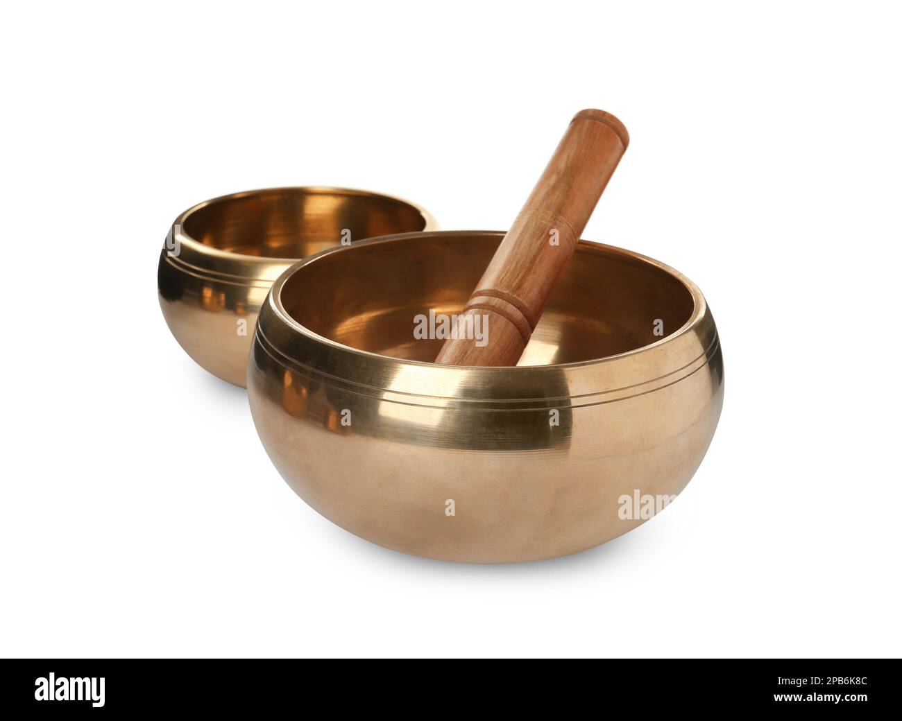 Tibetan singing bowls and wooden mallet on white background Stock Photo ...