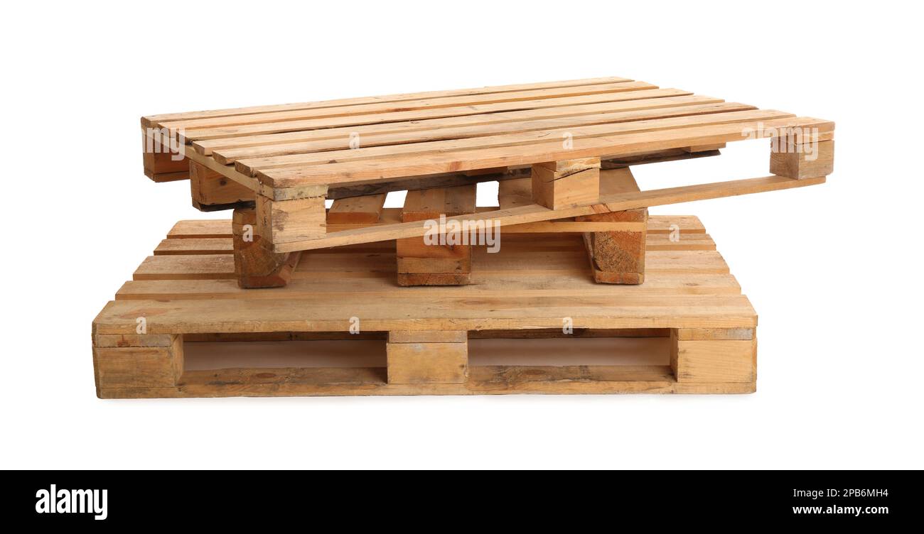Stacked wooden pallets isolated on white. Transportation and storage ...